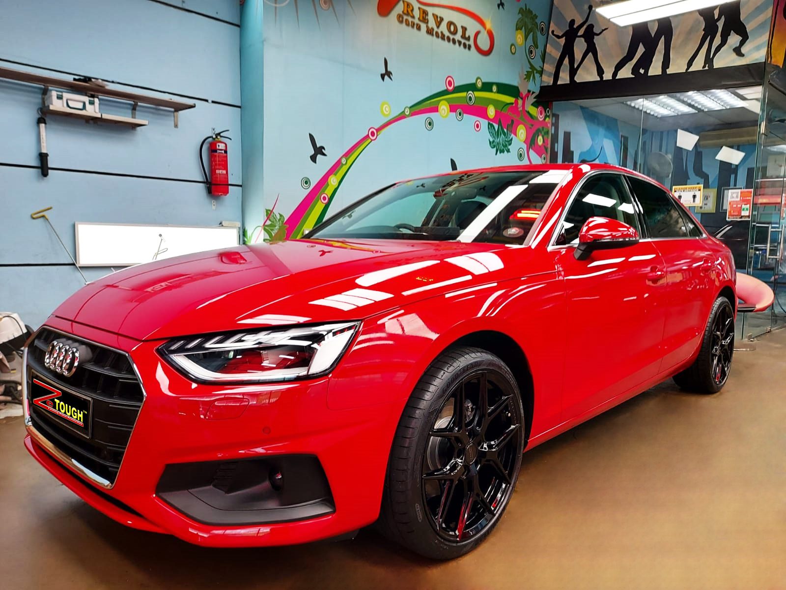 A sporty red Audi A4 with Ultimate Ceramic Paint Protection Coating